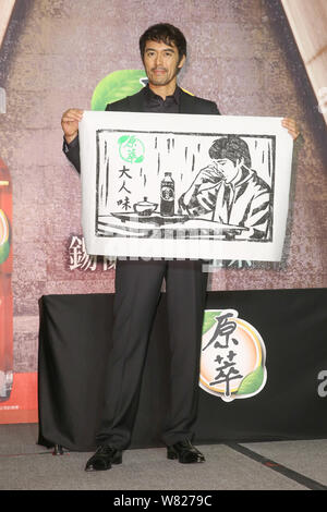 Japanese actor Abe Hiroshi, poses for photographs after winning the ...