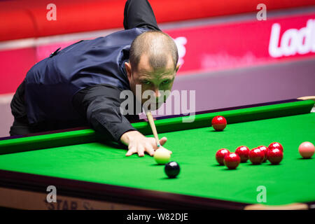 Ryan Day of Wales plays a shot against Mark Selby of England during ...