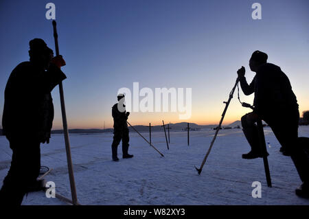 Workers collect ice blocks in Jiangbin Park to build an ice and snow ...