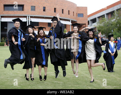--FILE--Chinese students studying abroad dressed in traditional ...