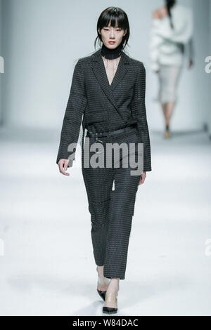 A model displays a new creation of the Spring/Summer 2015 Mashama X ShanghaiTang, Alex Wang X ...