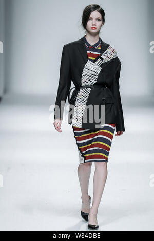 A model displays a new creation of the Spring/Summer 2015 Mashama X ShanghaiTang, Alex Wang X ...
