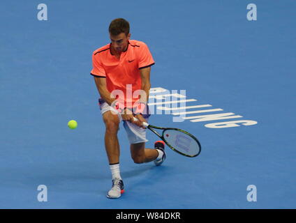 Andrei Kuznetsov of Russia returns a shot to Andy Murray of Britain in ...