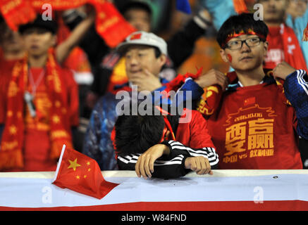 Chinese football fans react after the Chinese national soccer team ...