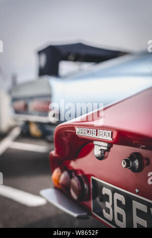 A red cinematic shot of vintage car with 666 sprayed on the trunk Stock ...