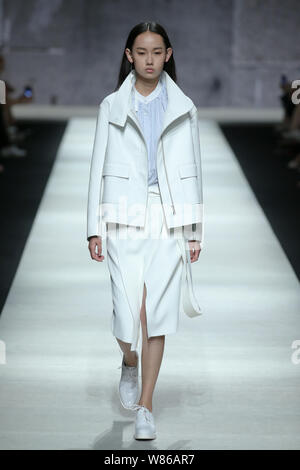 Chinese fashion designer Lv Yan or Lu Yan greets guests at a fashion ...