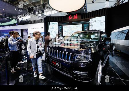 --FILE--Chinese visitors look at a Hongqi (Red Flag) concept SUV of FAW ...