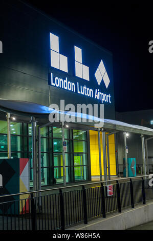London Luton Airport, UK, check-in hall. Easyjet passengers queue to ...