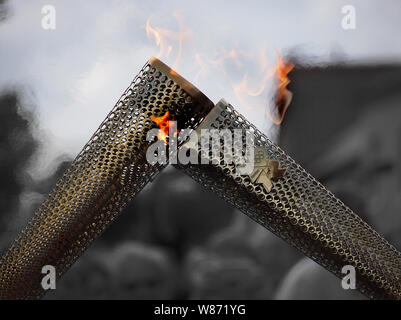The Olympic torch Kiss Stock Photo - Alamy