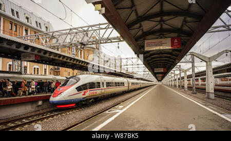 Modern hybrid electric locomotive Sapsan pulling a high-speed train ...