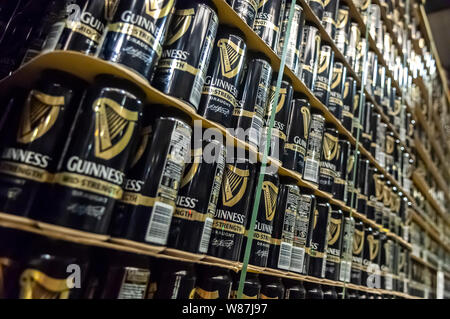 Rows of Guinness cans stored and strapped onto pallets Stock Photo - Alamy
