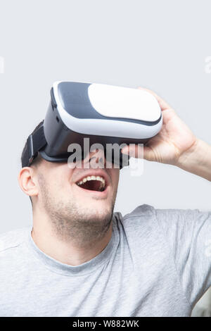 Handsome man in virtual reality goggles. Space for your text Stock ...