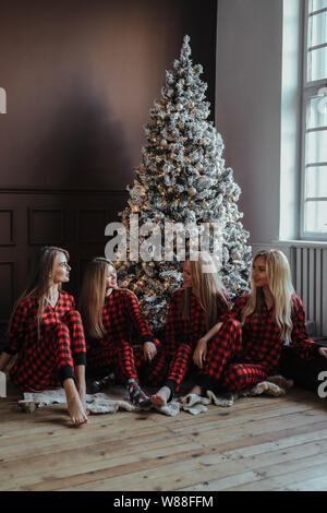 Group of friends in Christmas pajamas Stock Photo - Alamy