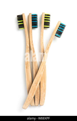 top view of bamboo brown toothbrushes on white background Stock Photo ...