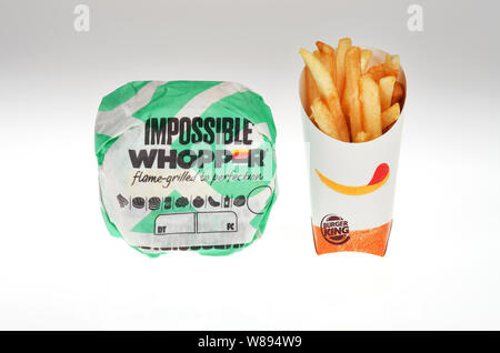 Burger King Whopper in wrapper on white background. Cut out Stock Photo ...