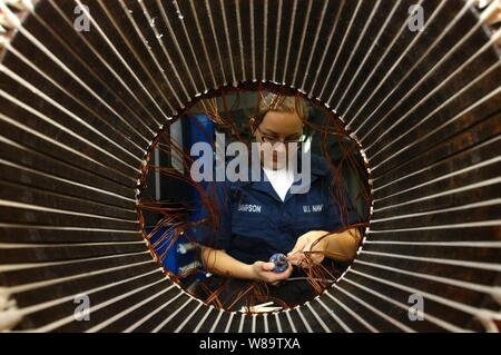 A seaman aboard the nuclear-powered aircraft carrier USS NIMITZ (CVN-68 ...
