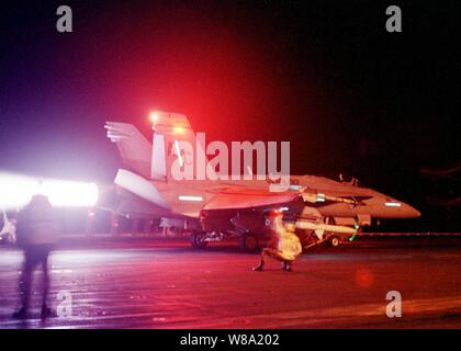 Personnel from Marine Fighter Attack Squadron 235 (VMFA-235) do a final ...