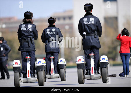 --FILE--Chinese police officers patrol the Beijing West Railway Station ...