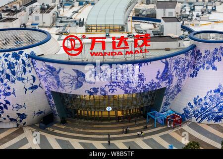 People visit the Wanda Mall at the Nanchang Wanda Cultural Tourism City ...