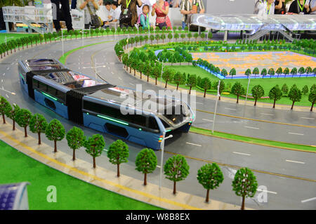A model of the 'Transit Elevated Bus' is on display during the 19th ...