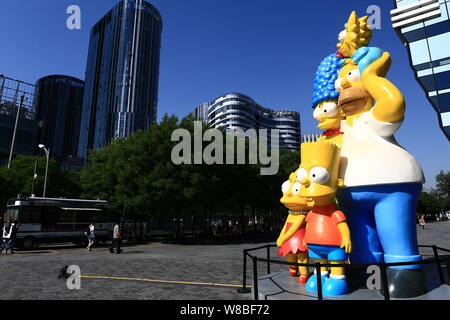 Model figures of The Simpsons are on display in front of The Simpsons ...
