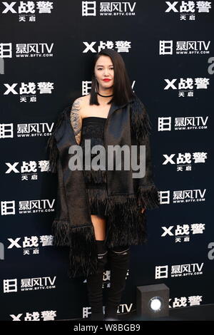 Chinese singer Tan Weiwei arrives for a premiere event of the movie "X ...