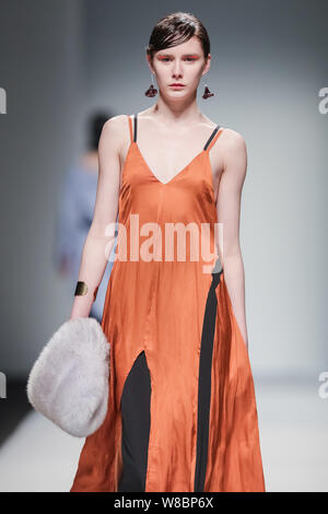 A model displays a new creation at the MAKEMAKE fashion show during the ...