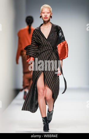 A model displays a new creation at the MAKEMAKE fashion show during the ...