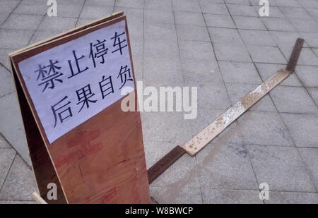 Chinese car parking sign in Beijing, China depicting standard symbols ...