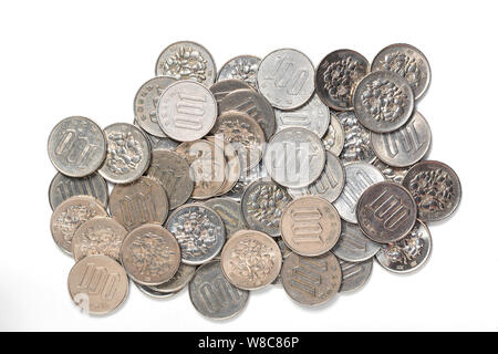 Pile of 100 yen coins japanese money, close up isolated on white ...