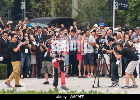 Spectators watch the hydrogen peroxide-powered jetpack propelling pilot ...
