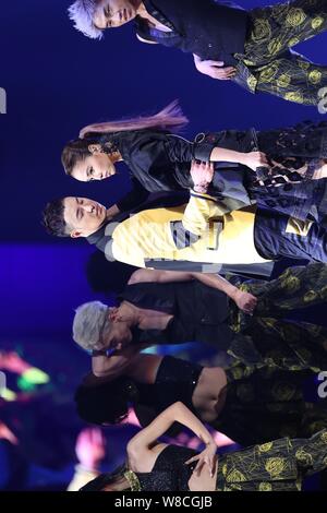 Taiwanese singers Jolin Tsai, right, and Wilber Pan perform at Pan's ...