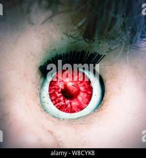 macro image of a old spooky doll,s red eyes Stock Photo - Alamy