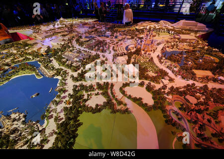 A scale model of the Shanghai Disney Resort is on display during its ...