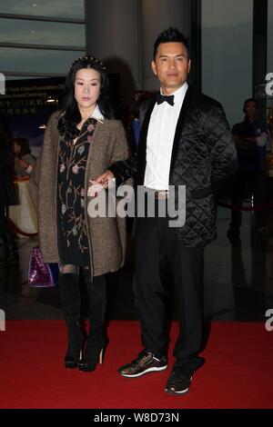 Hong Kong actor Ray Lui, right, poses with his wife Yang Xiaojuan ...