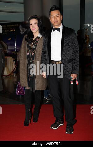 Hong Kong actor Ray Lui, right, poses with his wife Yang Xiaojuan ...