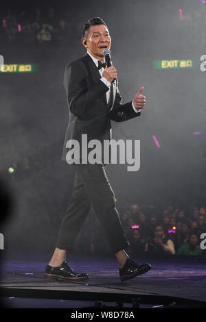 Hong Kong singer and actor Andy Lau poses with his trophy during the ...