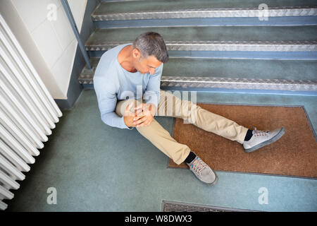 Senior man fallen on stairs in suburban home, USA Stock Photo - Alamy