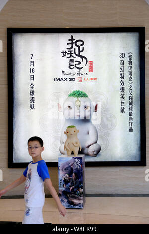 --FILE--A poster for the movie "Monster Hunt" and a model of Wuba, a ...
