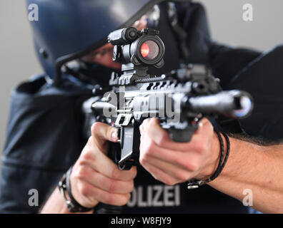 Wiesbaden, Germany. 09th Aug, 2019. A police officer presents a new G38 ...