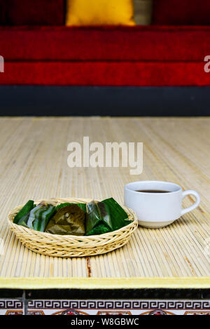 Authentic Bali sweets from rice flour with cup of tea Stock Photo - Alamy