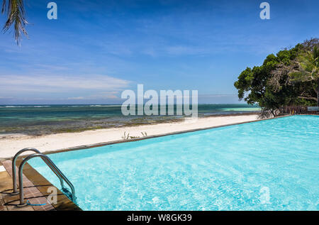 Swimming pool of luxurious african resort and Diani beach seascape in ...