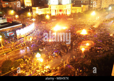 Visitors and people of Yi ethnical minority gather to celebrate the ...