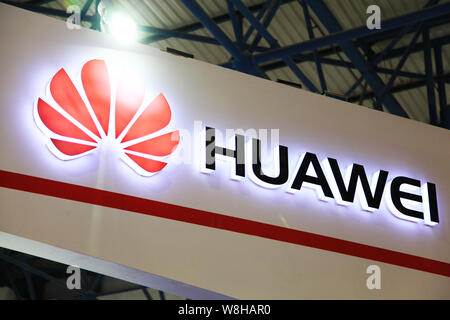 --FILE--A signboard of Huawei is seen during the 16th China ...
