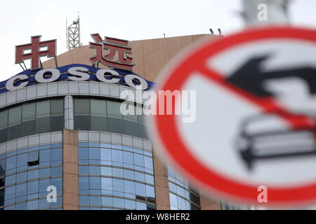 The logo of Cosco is on display on the rooftop of the headquarters ...