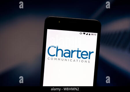 In this photo illustration, the Charter Communications logo is seen ...
