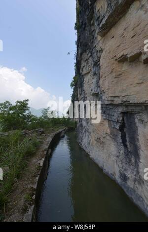 View of the Hongqi Canal, an artificial aqueduct canal, along a cliff ...