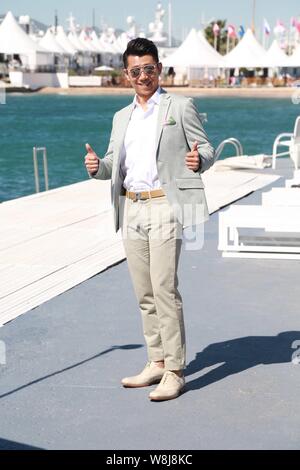 Chinese actor Xia Yu poses at a photocall for his movie "The Ghouls ...