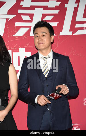 Chinese actor Tong Dawei poses on the red carpet as he arrives for the ...