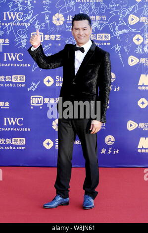 Hong Kong actor Ray Lui poses on the red carpet for the opening ...